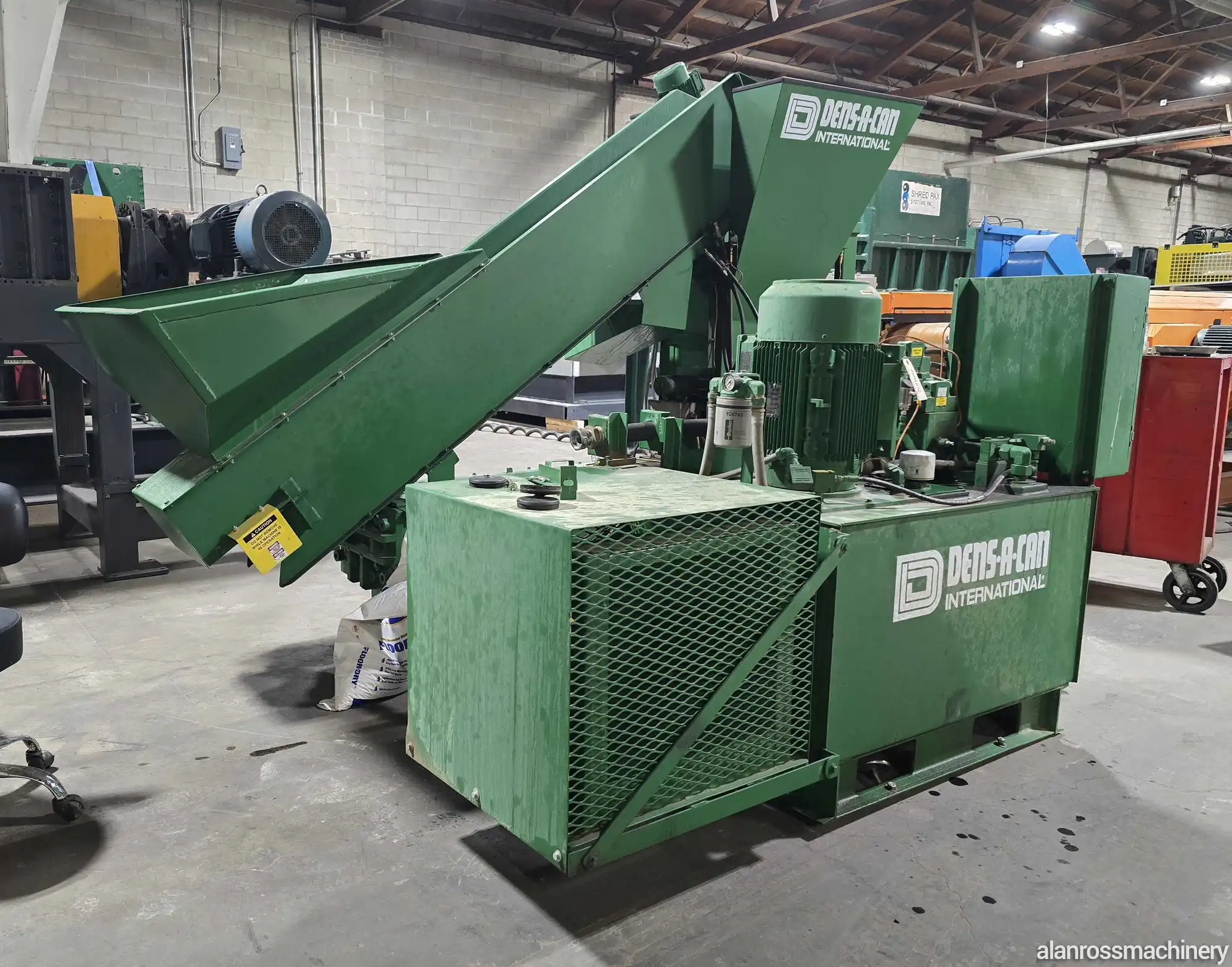 DAC 1200 Used Dens-A-Can Can Densifier with Conveyor | Alan Ross Machinery